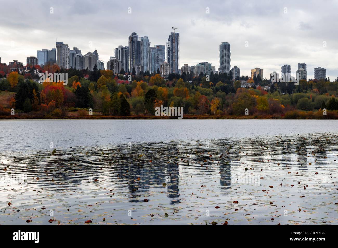 Beautiful autumn water reflection. High rises reflecting back in the ...