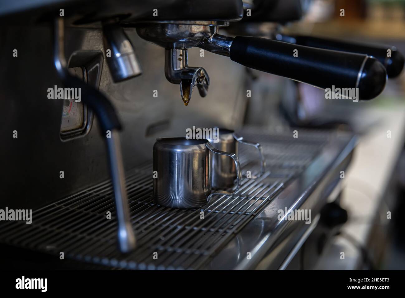 Close up of the process of making espresso in a professional coffee ...