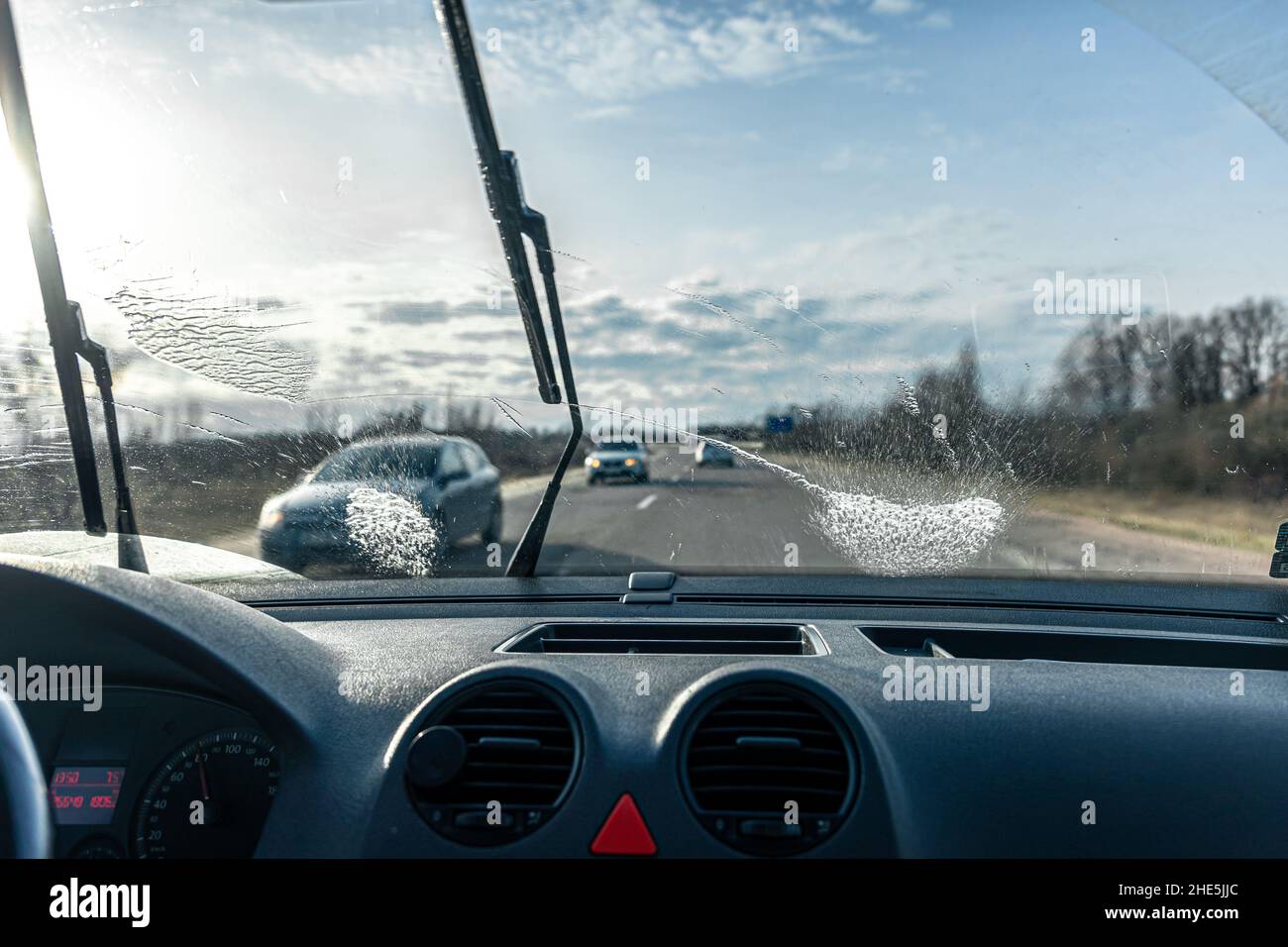 Car wipers clean windshields when driving in sunny weather Stock Photo ...