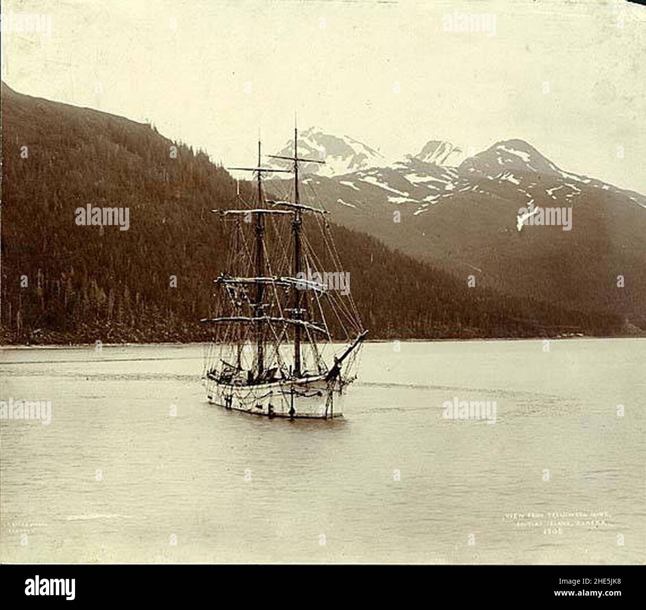 Sailing vessel at anchor in waters near Treadwell Gold Mining Company ...