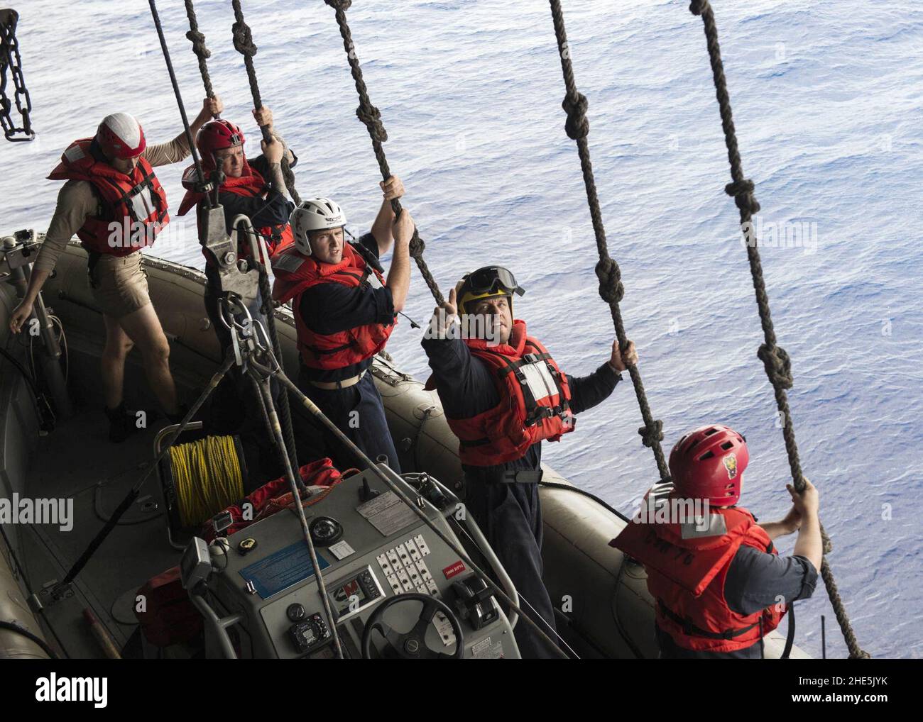 Sailor gives a thumbs up to the davit captain to inform him that the ...