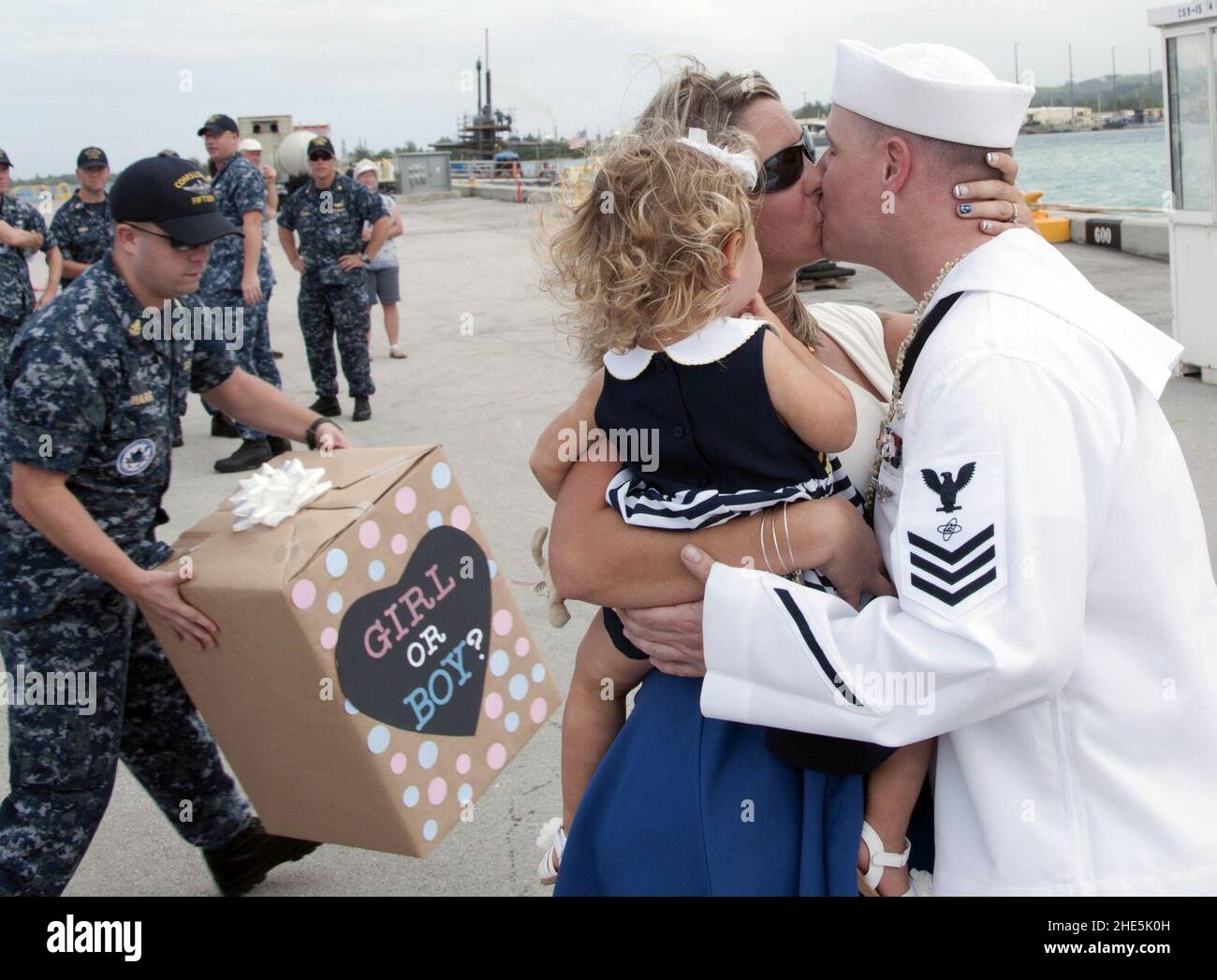 Sailor is greeted with the first kiss by his wife during a homecoming ...