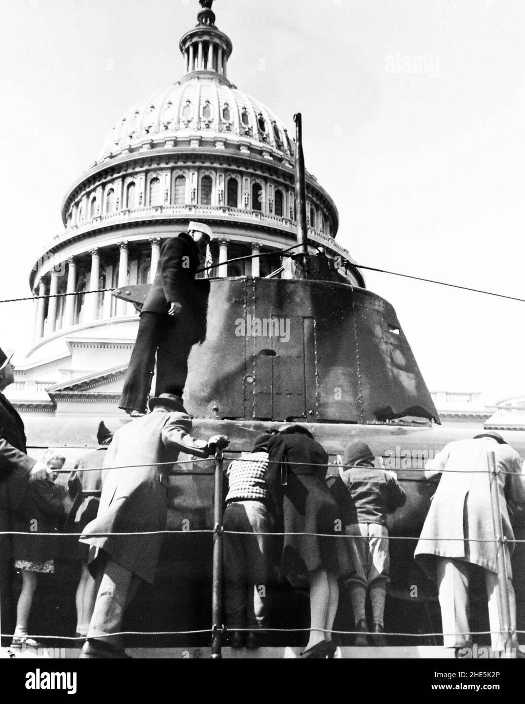 Sailor next to Japanese submarine conning tower of HA-19 at the U.S ...
