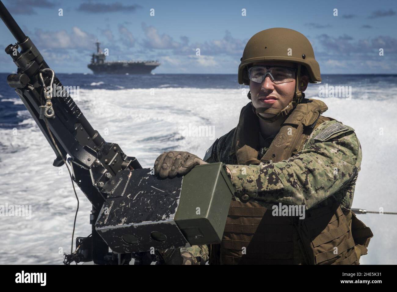 Sailor mans an M240G machine gun aboard a Mark VI patrol boat ...
