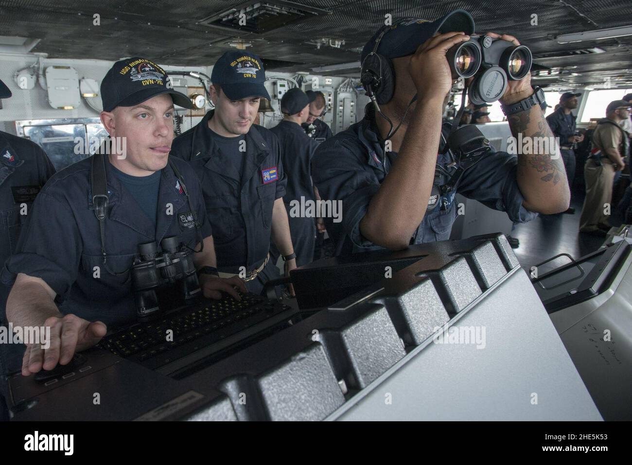 Sailor operates the navigation radar aboard the USS Ronald Reagan ...