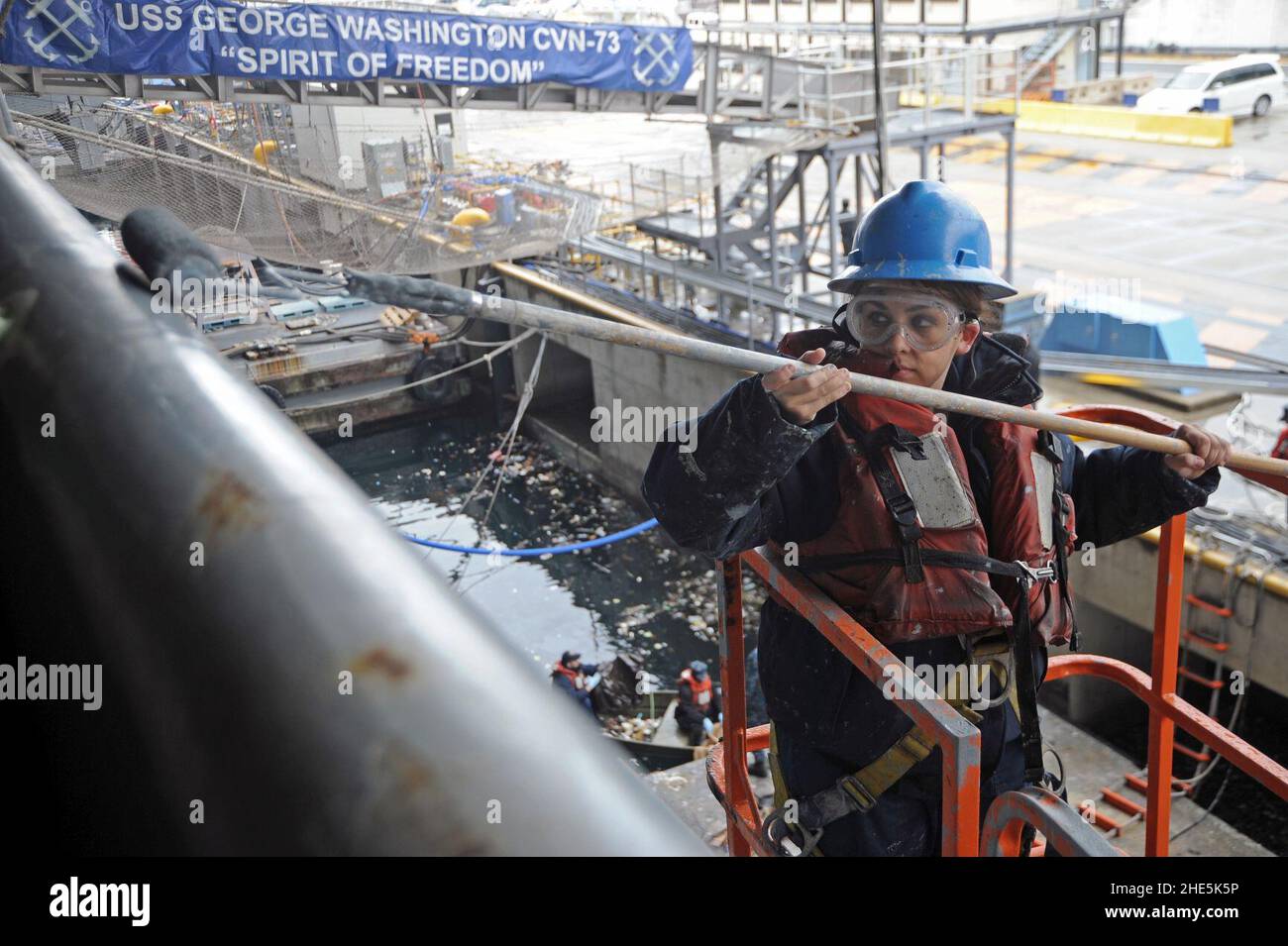 Sailor paints USS George Washington 121204 Stock Photo - Alamy