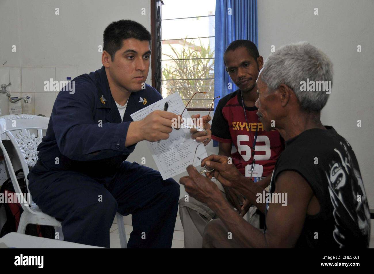 Sailor Performs Eye Exam on USNS Mercy Stock Photo - Alamy