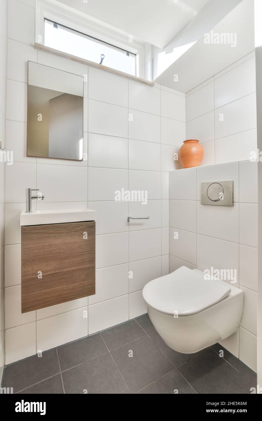 Interior of small clean restroom in miniature style Stock Photo - Alamy