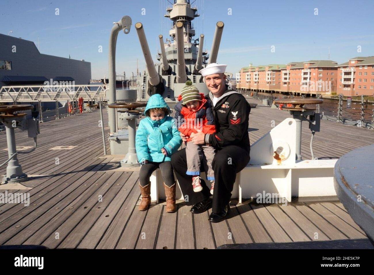 Sailor poses for photo aboard battleship USS Wisconsin 15021 Stock ...