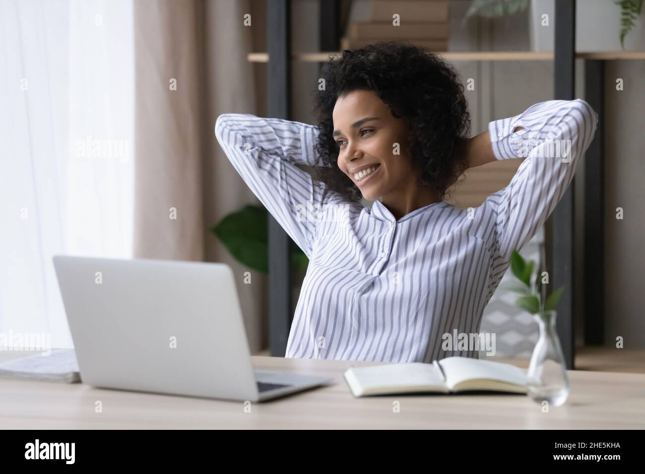 Happy young african businesswoman enjoying break time Stock Photo - Alamy