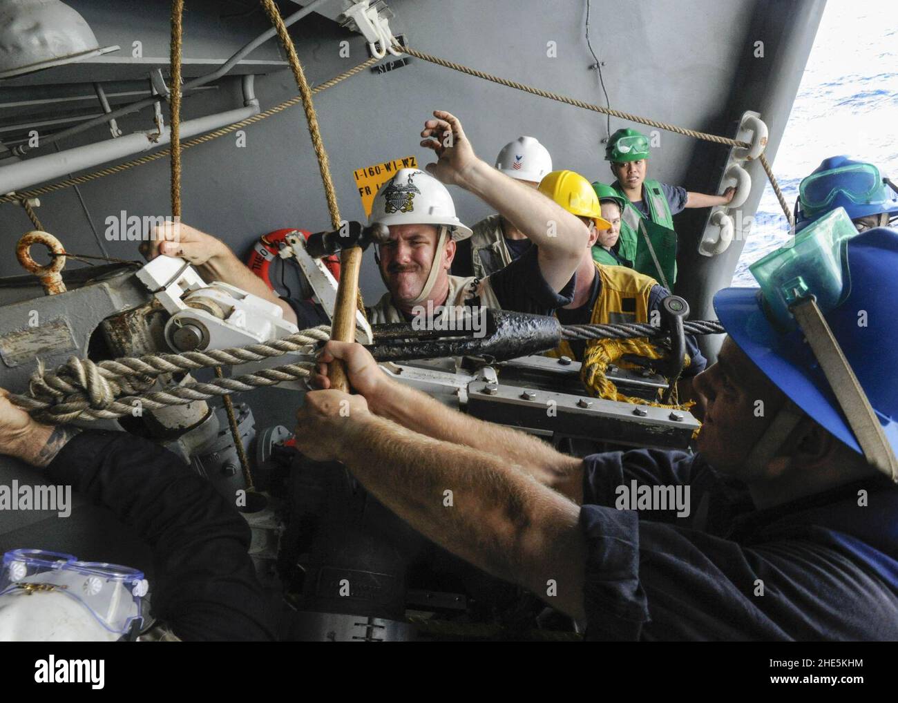 Sailors aboard the USS Theodore Roosevelt secure a fuel probe from INS ...