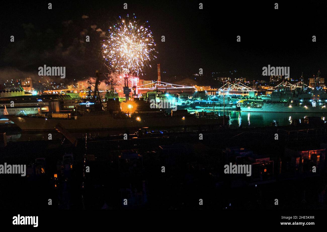 Sailors and guests watch New Year’s Day fireworks aboard USS Ronald ...