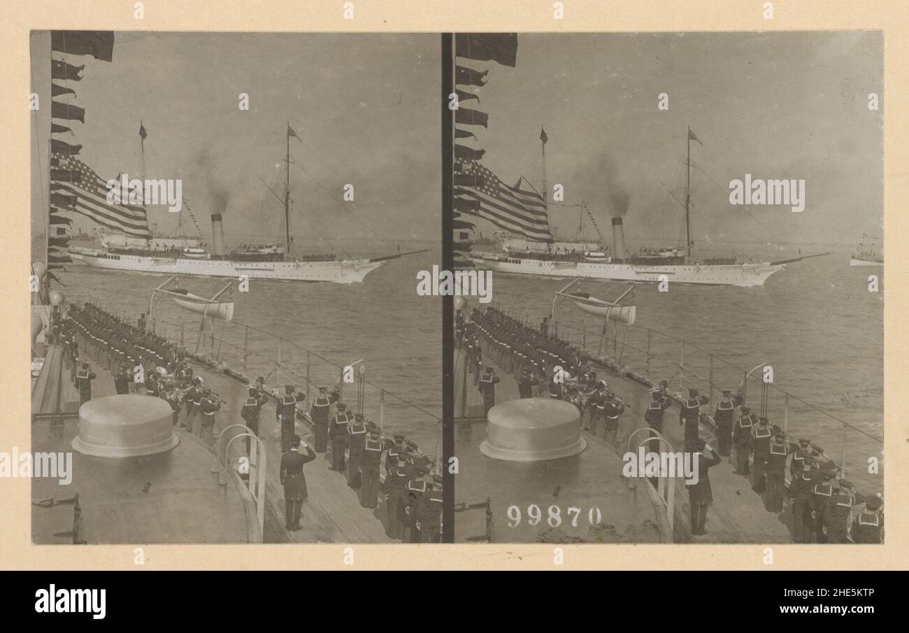 Sailors and marching band on deck of ship saluting a ship passing by ...
