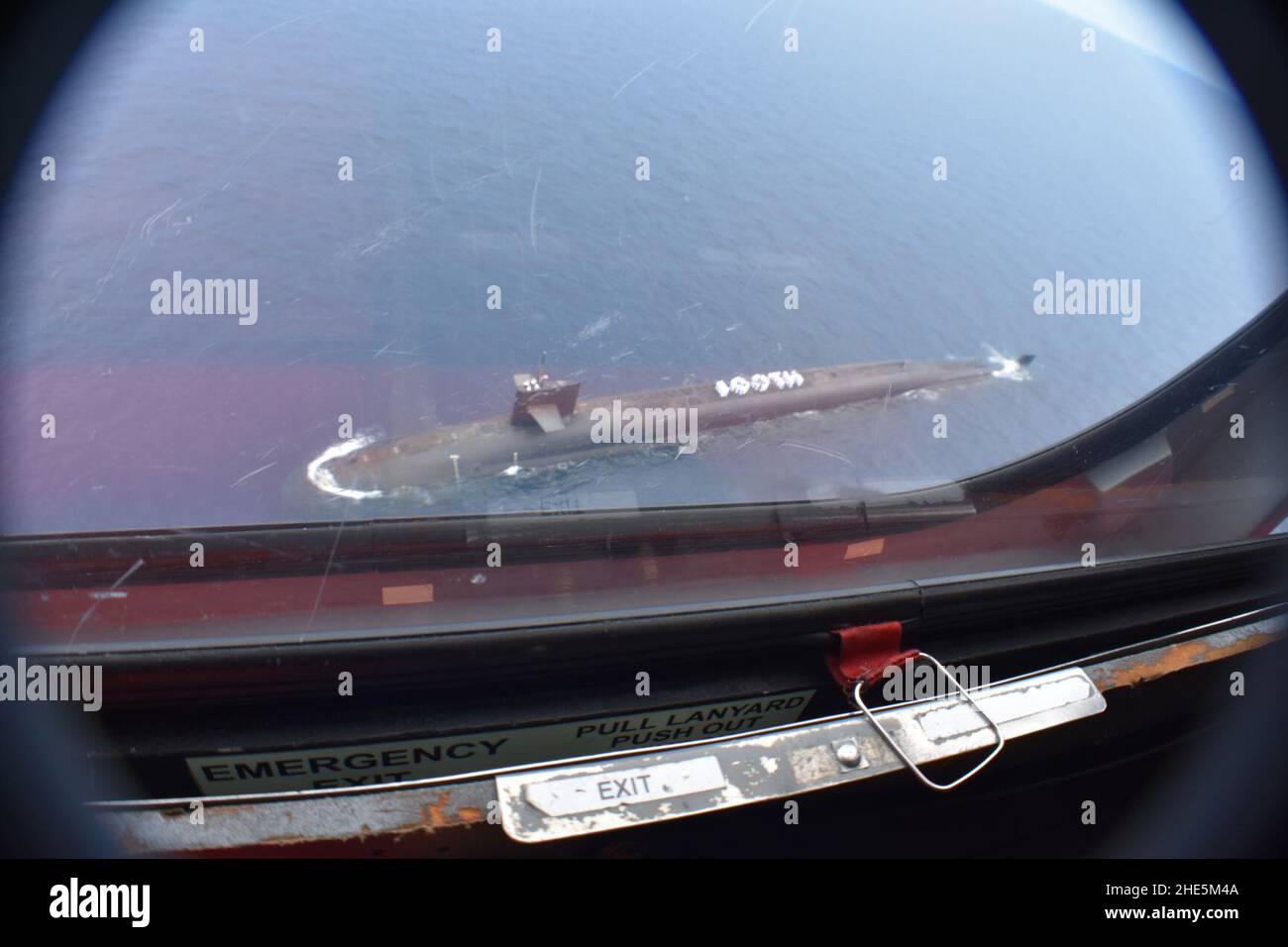 Sailors assemble topside to commemorate the submarine’s 100th patrol ...