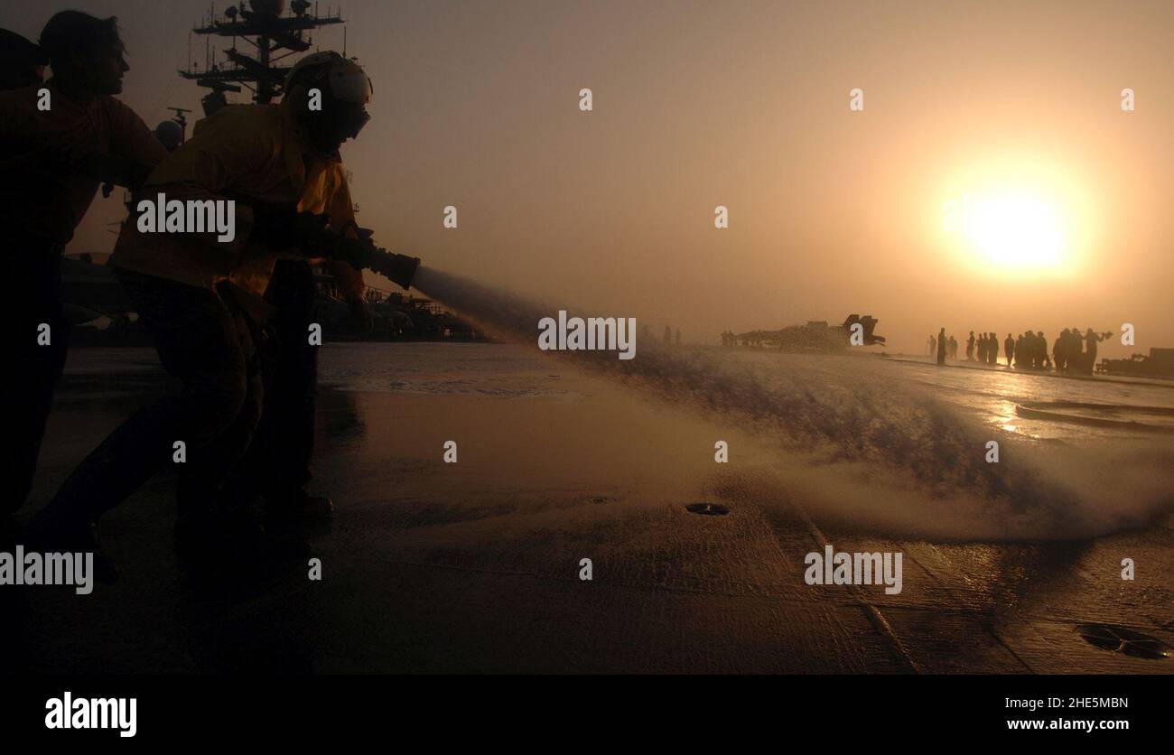 Sailors clean USS Harry S. Truman flight deck Stock Photo - Alamy