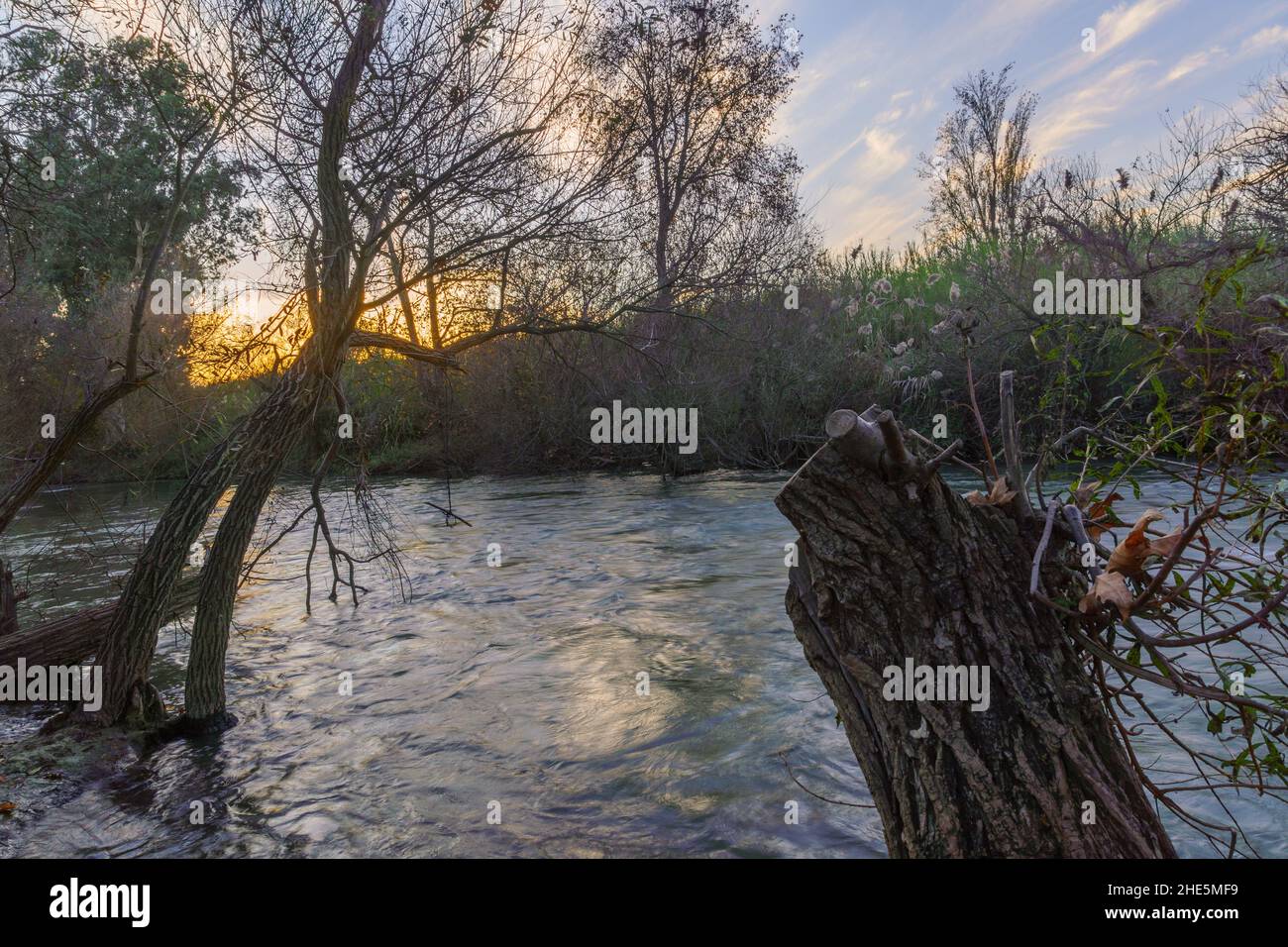 Sunset view of the origin point of the Jordan river, were the streams ...