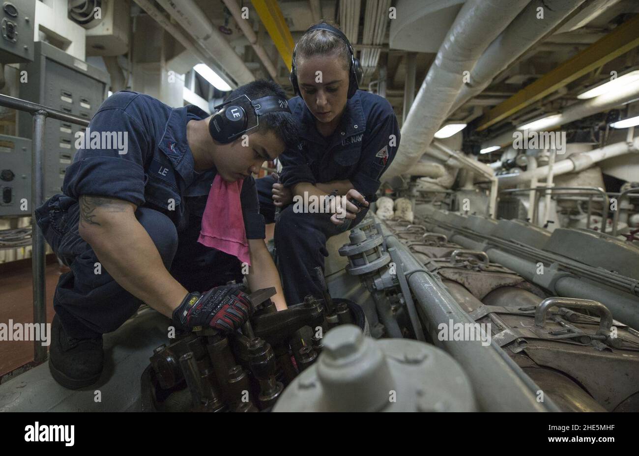 Sailors conduct maintenance aboard USS Pearl Harbor. (9194195338 Stock ...