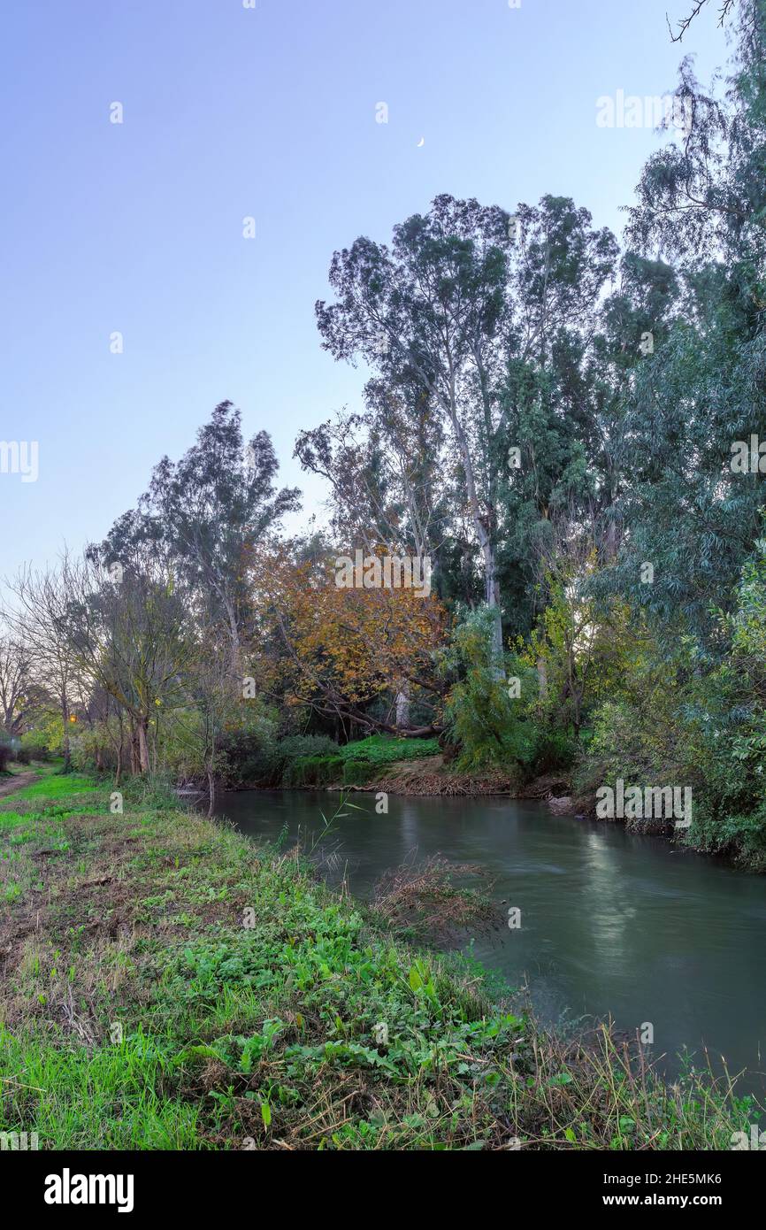 Sunset view of the origin point of the Jordan river, were the streams ...