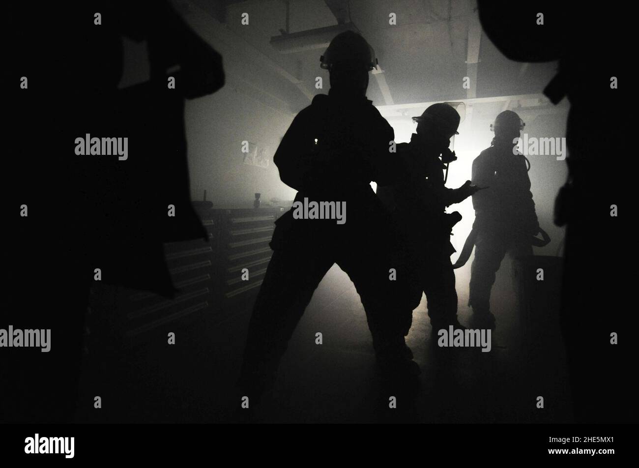 Sailors fight a simulated fire. (8408851724 Stock Photo - Alamy
