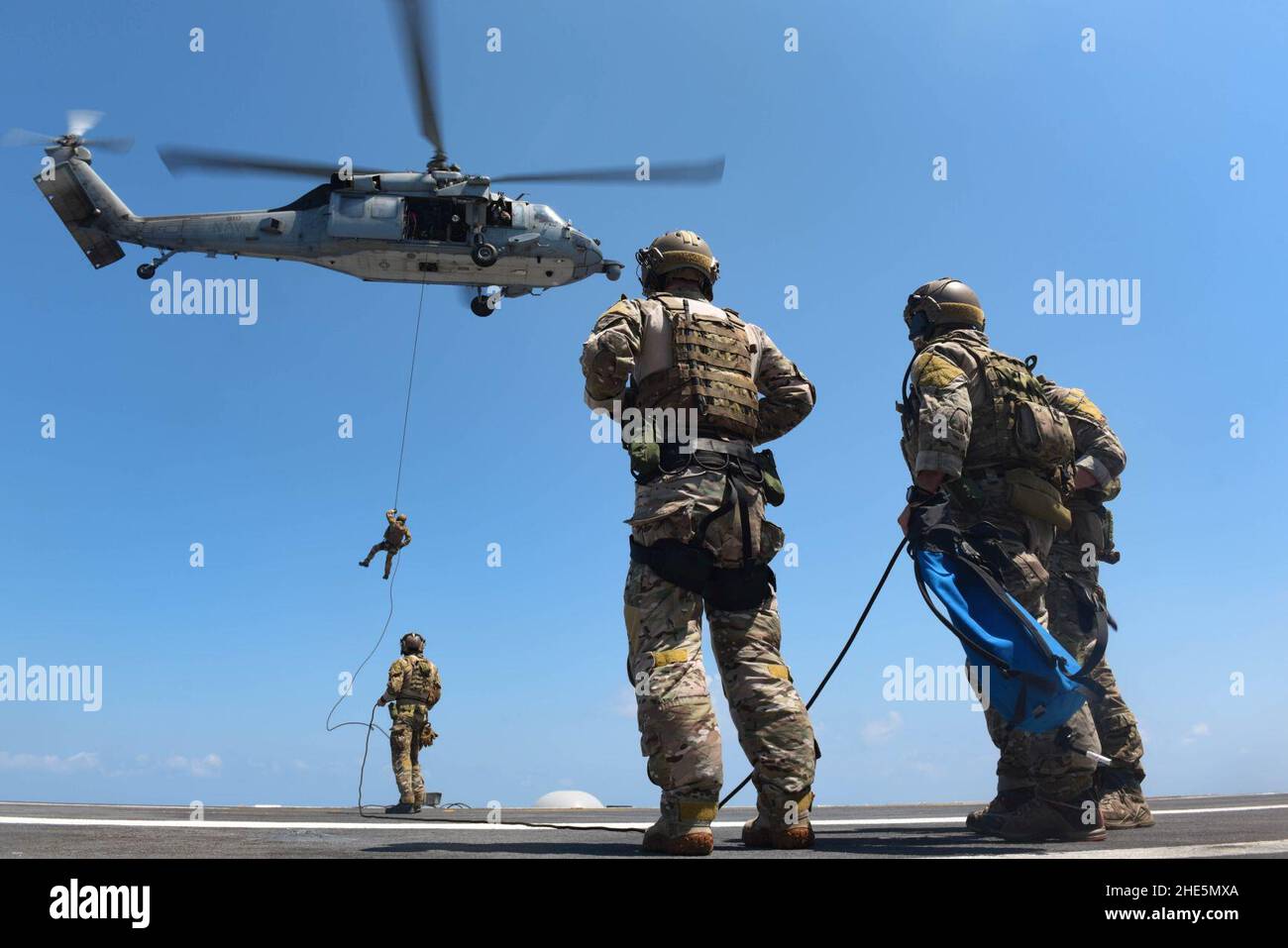Sailors fast-rope from an MH-60S Sea Hawk helicopter. (40298624450 ...