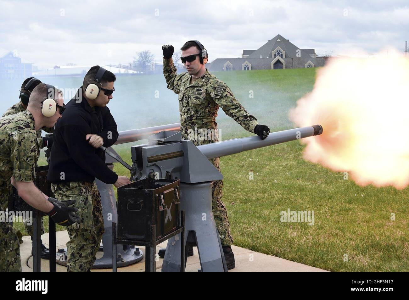 Sailors fire the ceremonial guns during recruit graduation ...