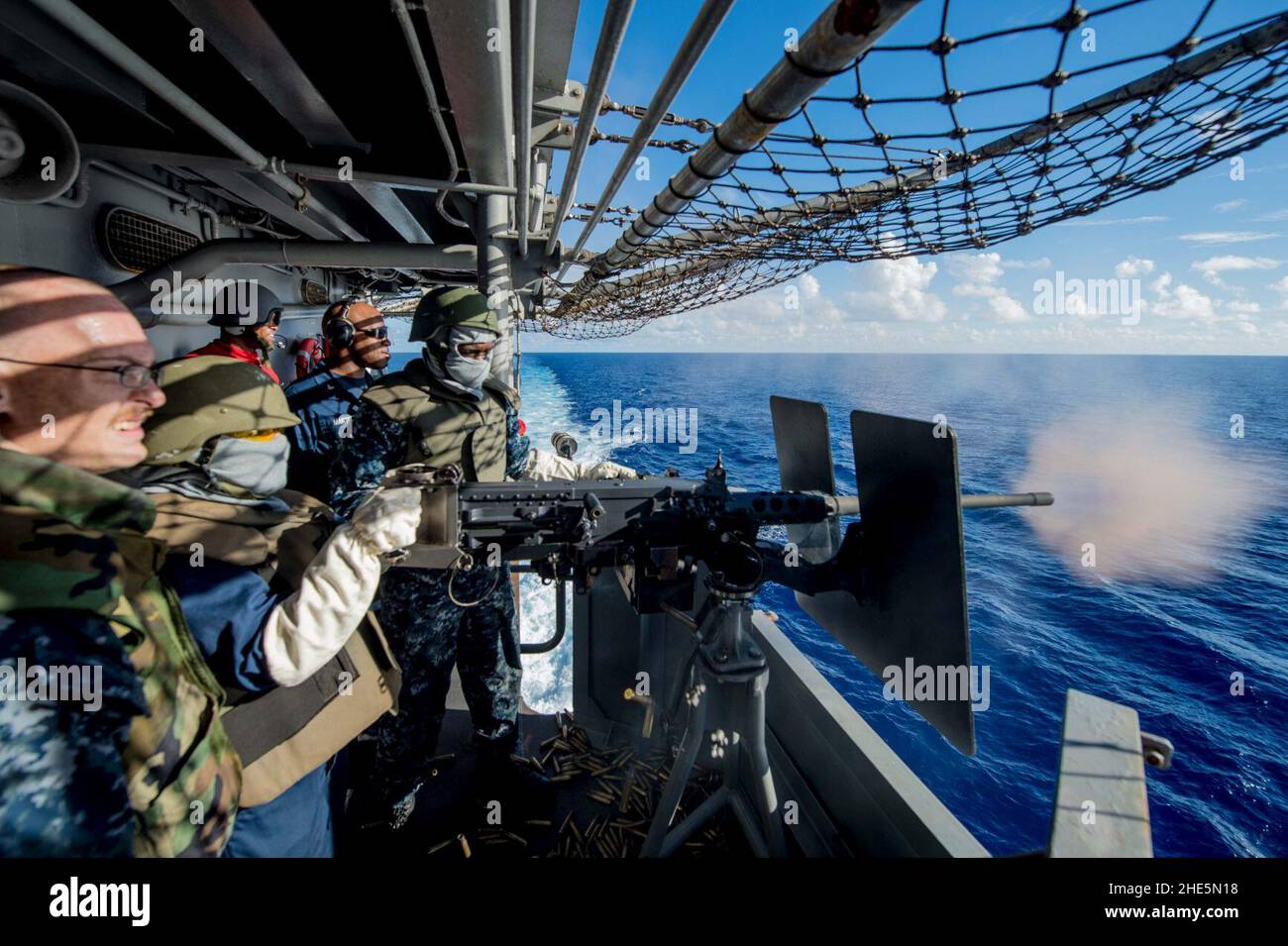 Sailors fire machine gun in Philippine Sea. (9192806354 Stock Photo - Alamy