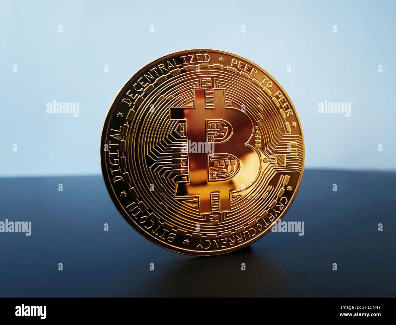 Bitcoin gold coin and defocused chart background. Virtual cryptocurrency concept Stock Photo - Alamy