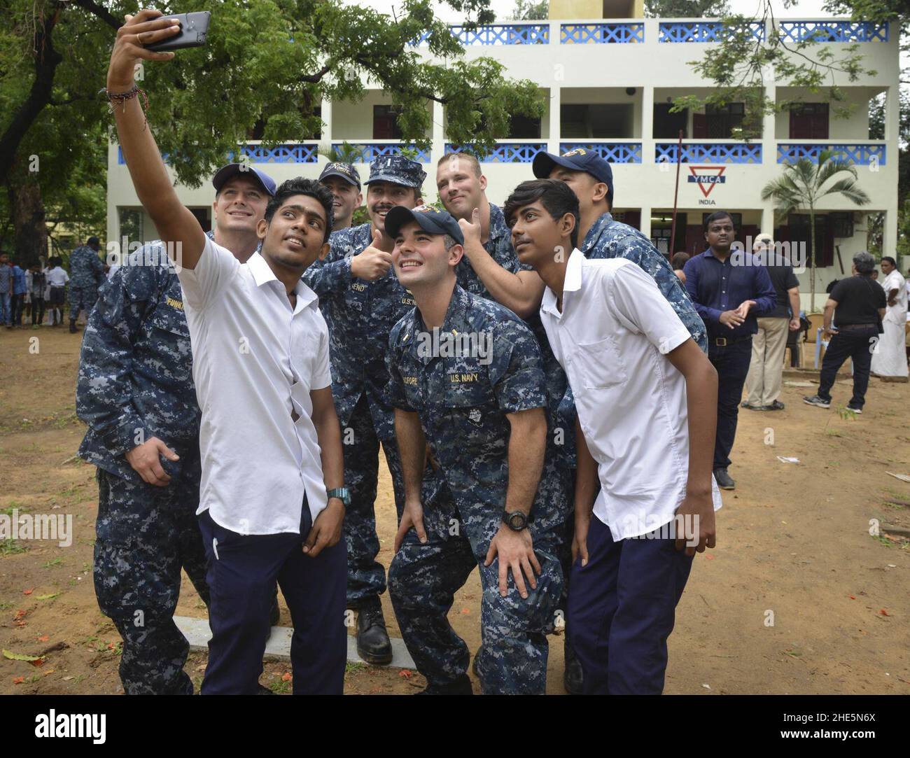 Sailors from Nimitz Carrier Strike Group (CSG) pose for a selfie with ...