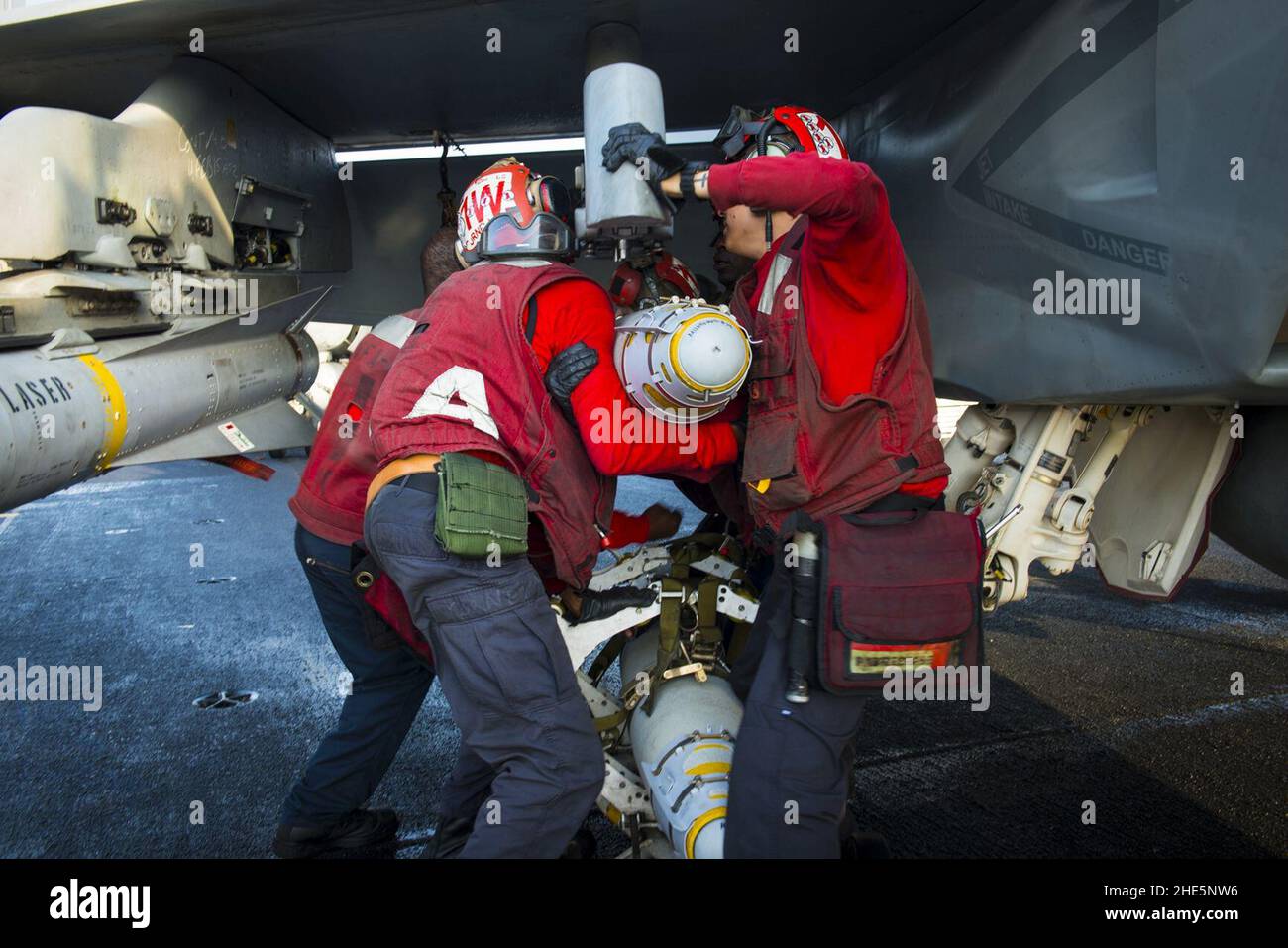 Sailors load a Mk 82 Blu 111 500 pound bomb. (16431385586 Stock Photo ...