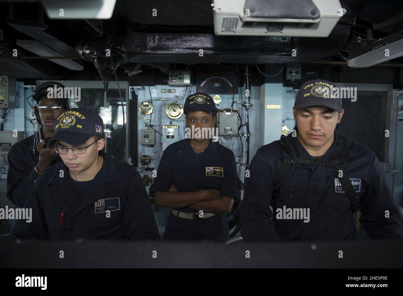 Sailors man the helm aboard USS Carney while departing Odessa, Ukraine ...