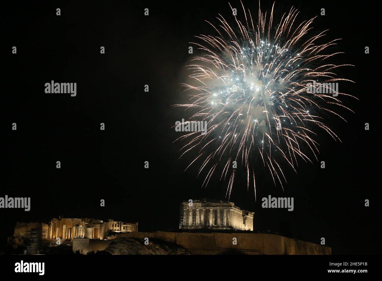 Fireworks explode over the ancient parthenon temple at the acropolis hi ...