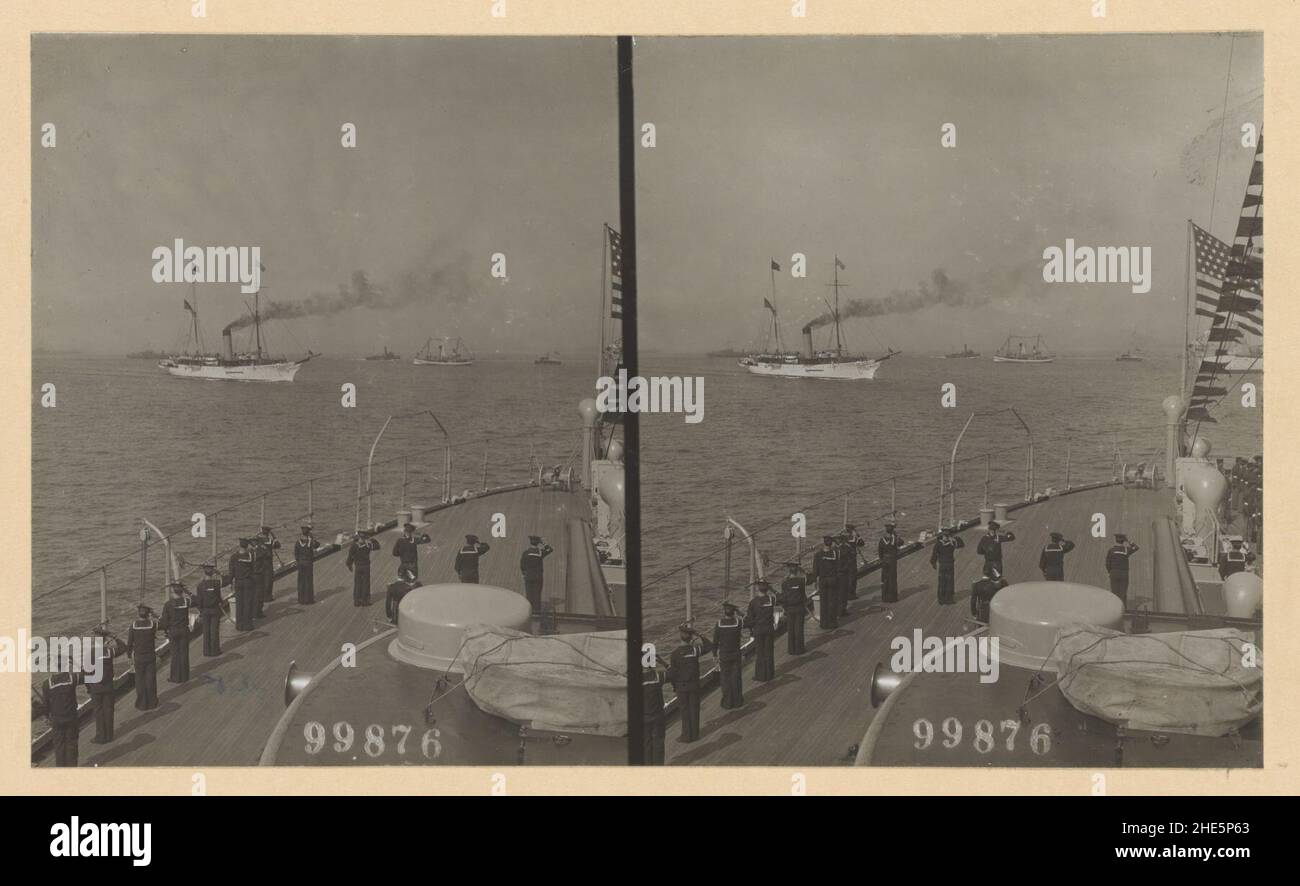 Sailors on deck of ship saluting a passing ship in the distance Stock ...