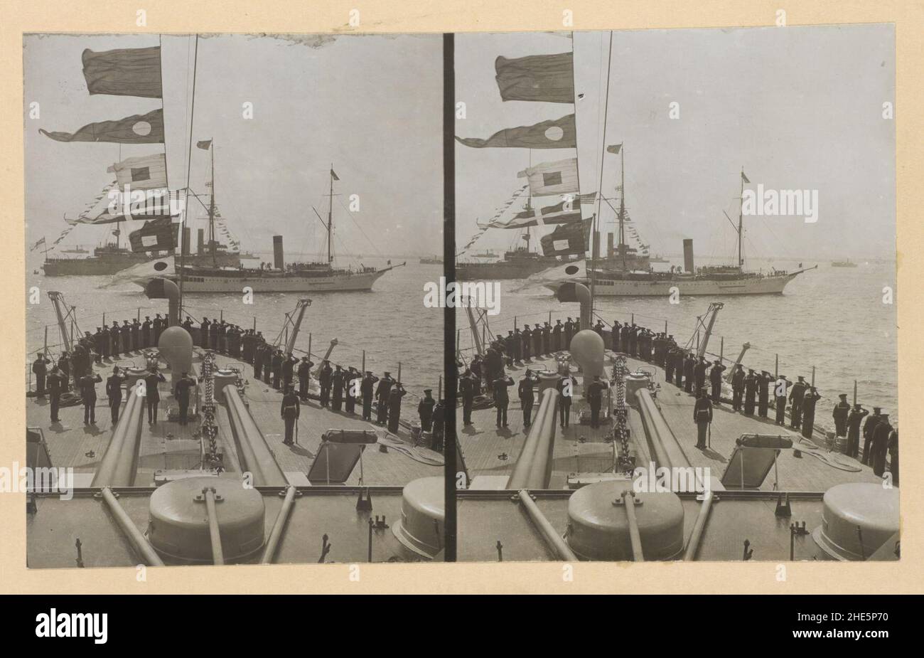 Sailors on ship deck salute at ship passing by Stock Photo - Alamy
