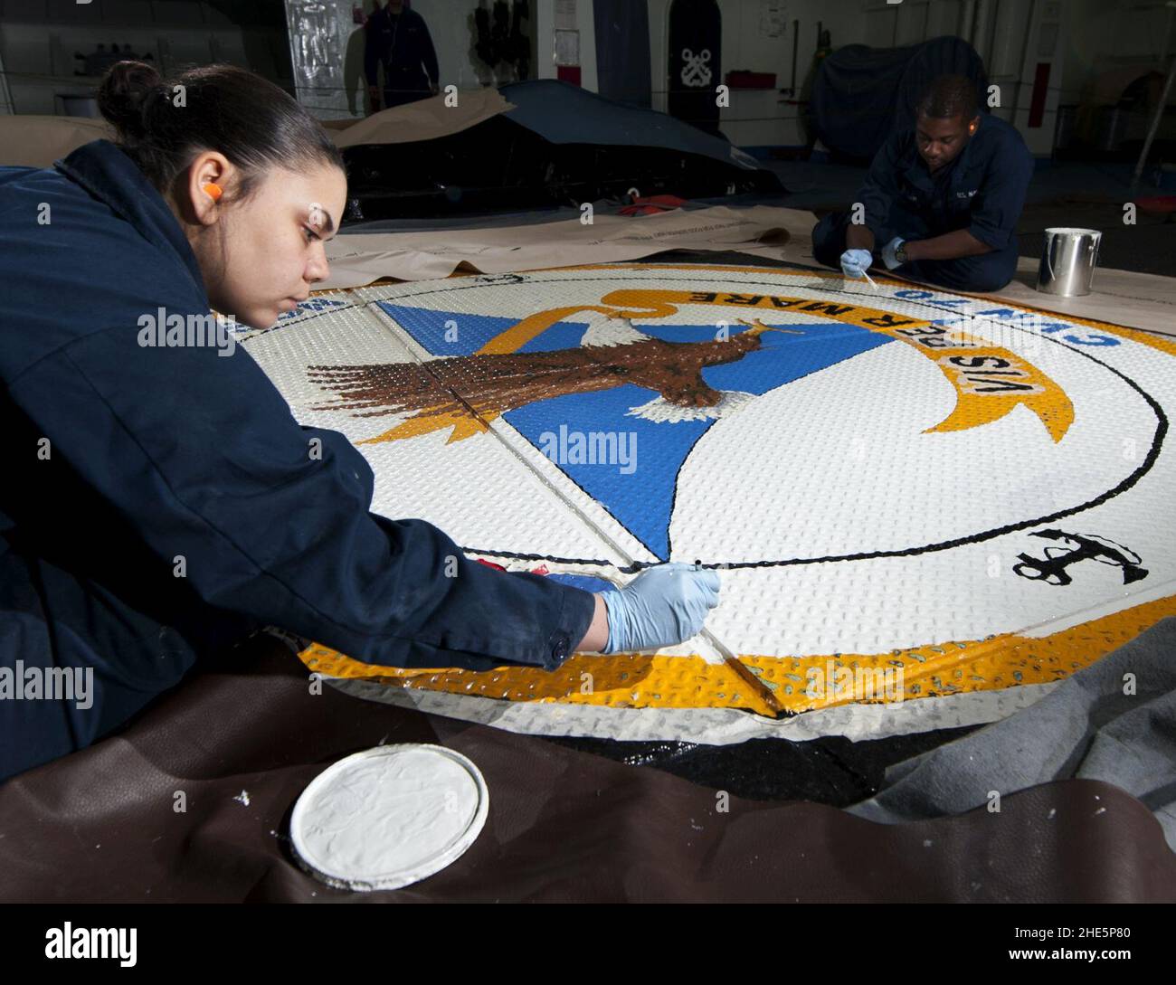 Sailors paint the ship's crest aboard USS Carl Vinson. (8488251061 ...