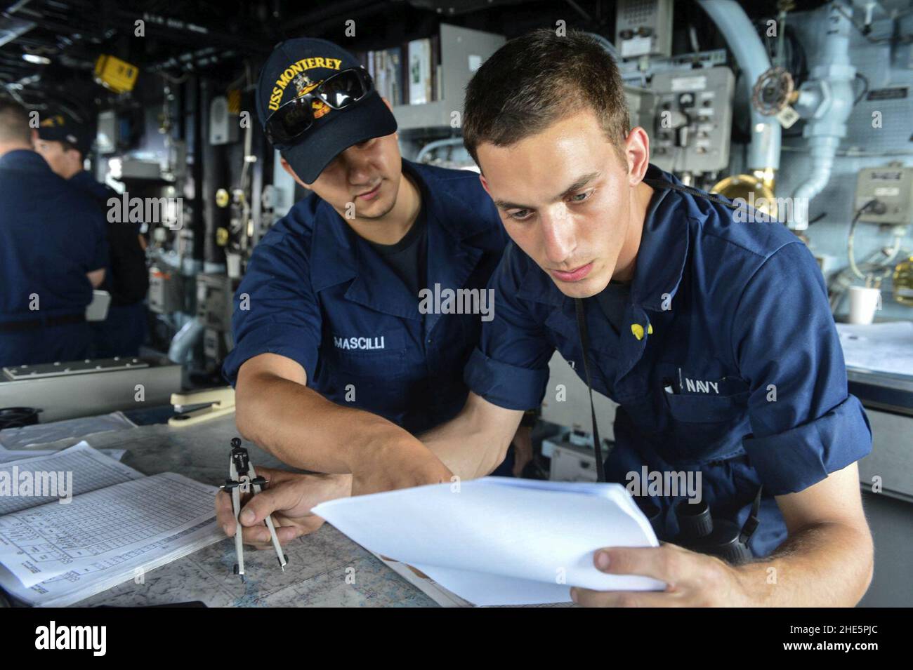 Sailors plot the ship's course. (9135089755 Stock Photo - Alamy