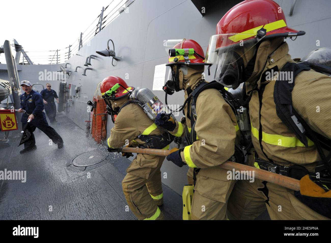Sailors practice firefighting at sea. (8202180991 Stock Photo - Alamy