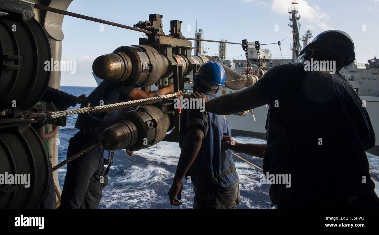 Sailors prepare to connect a fueling probe during a replenishment-at ...