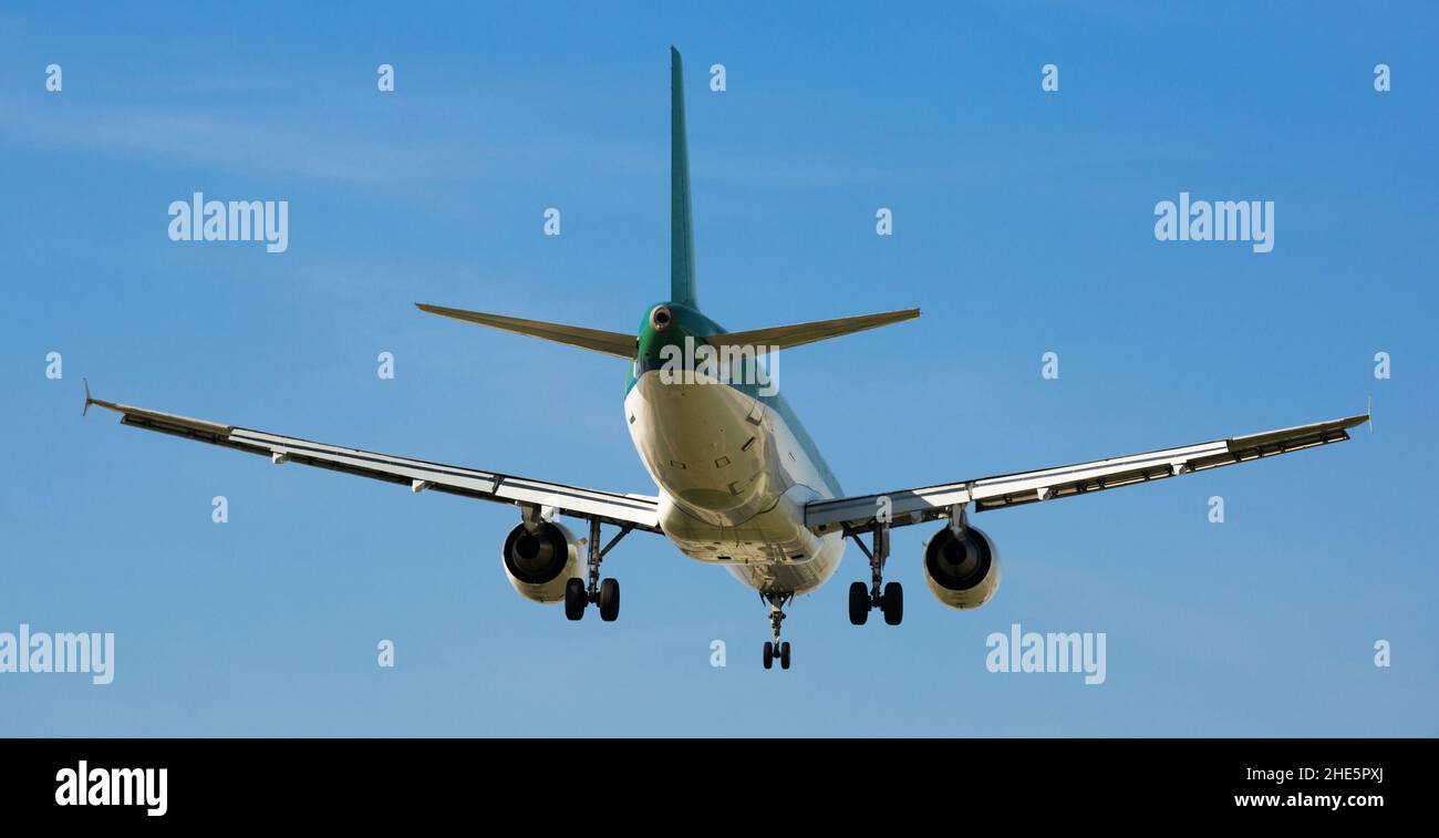 Passenger plane departing in afternoon Stock Photo - Alamy