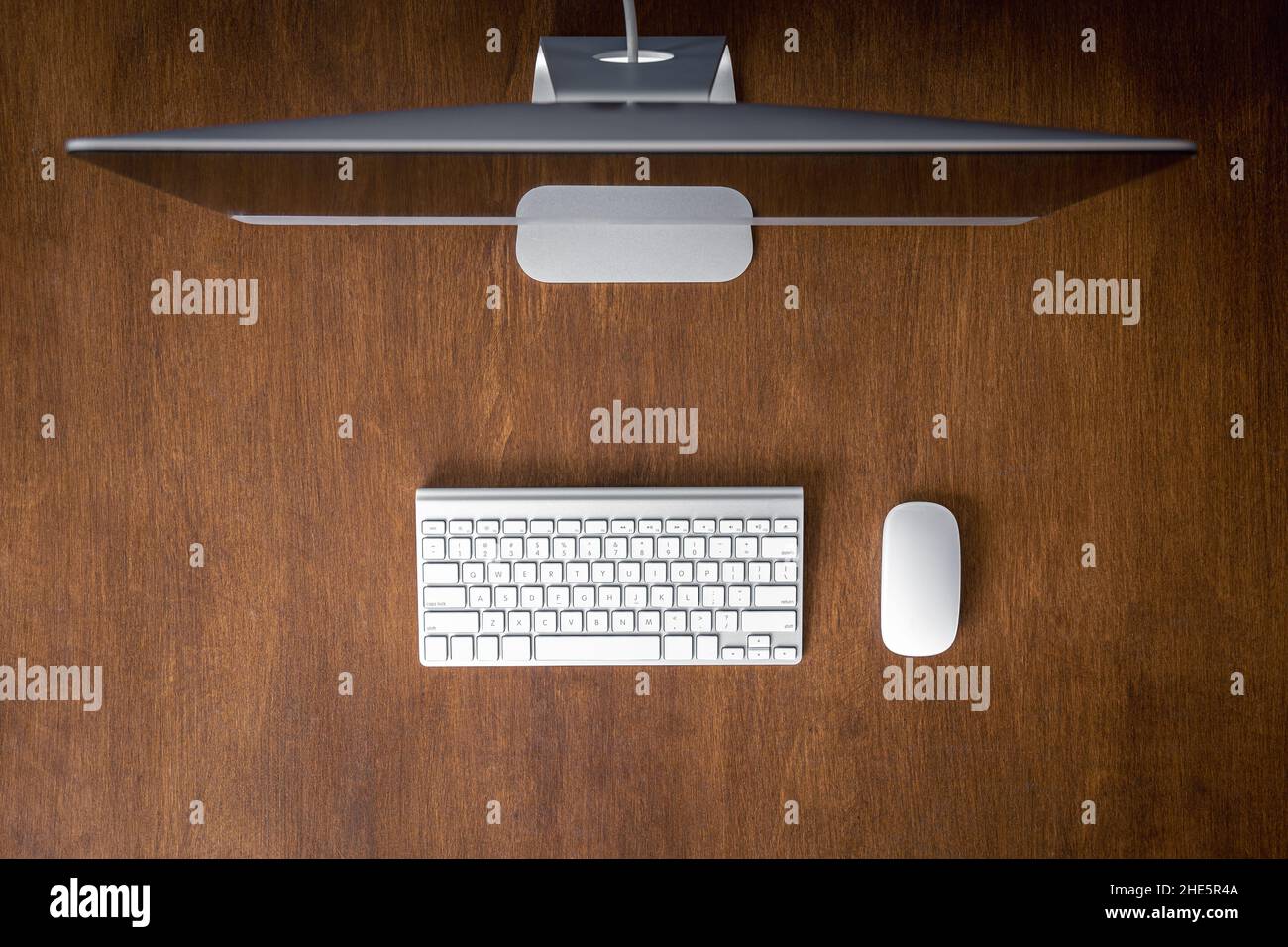 Top view, computer on a wooden table, work desk Stock Photo - Alamy