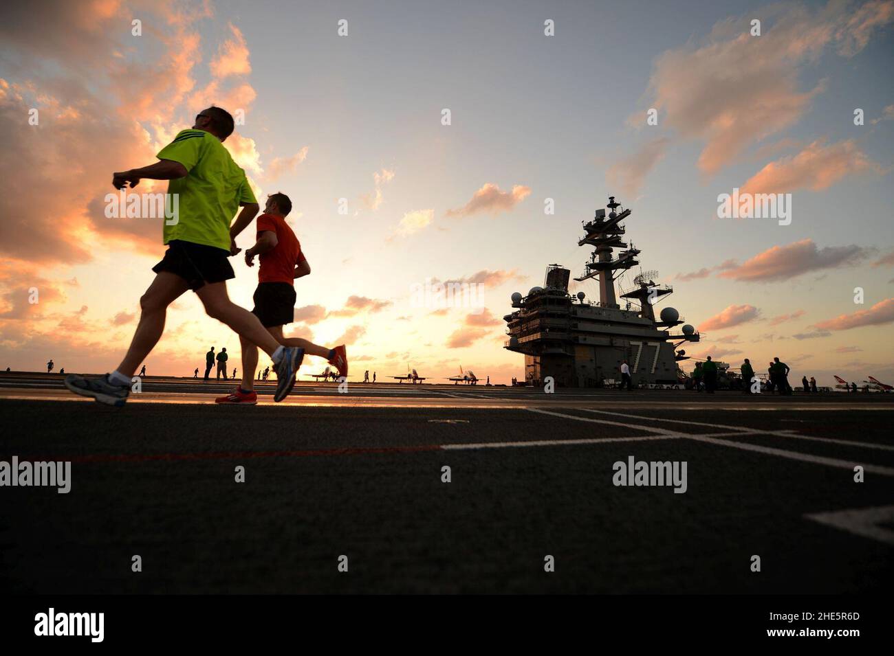Sailors run on flight deck of USS George H.W. Bush. (8693197474 Stock ...