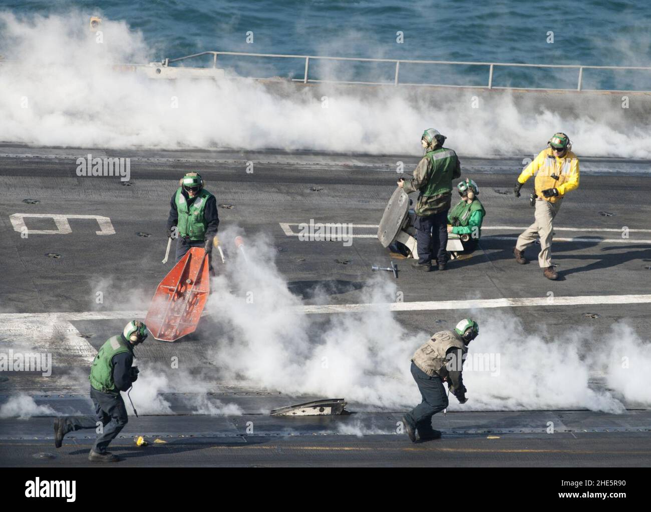 Sailors secure a catapult aboard USS Harry S. Truman. (11967405466 ...