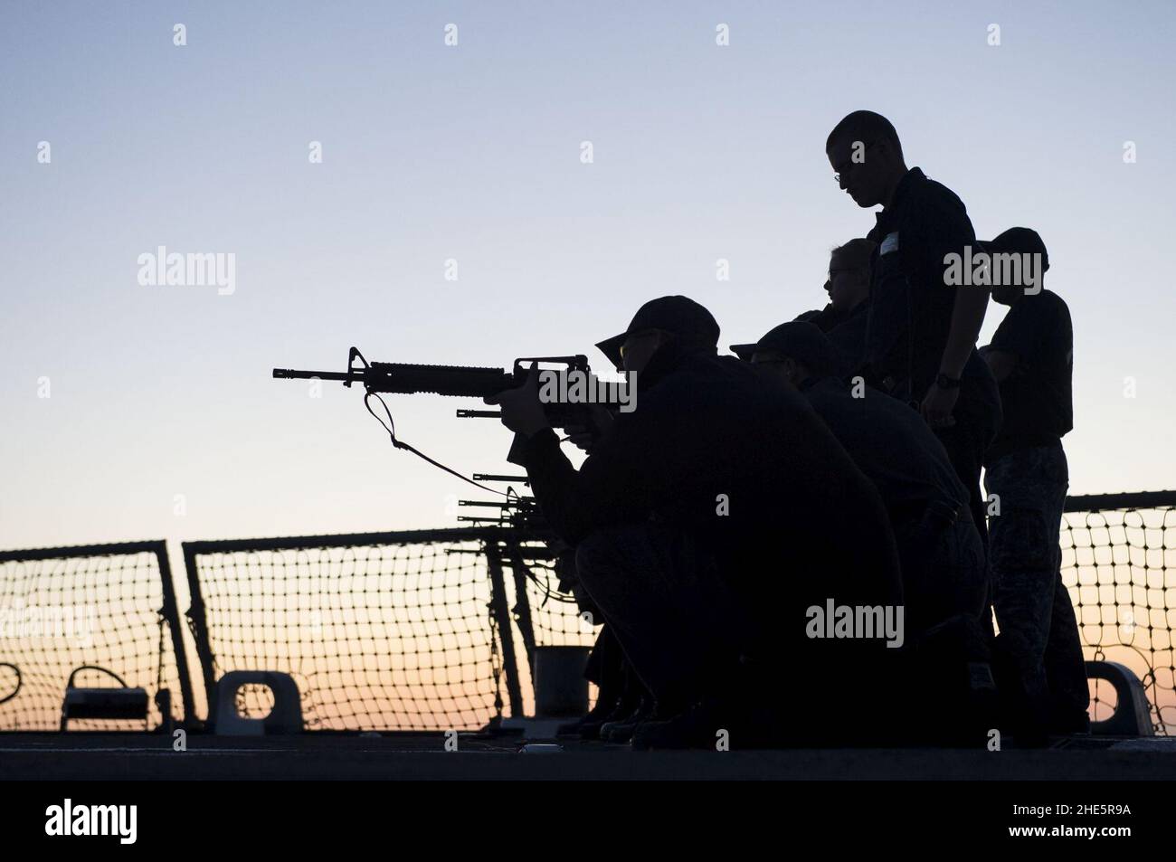 Sailors shoot M-16 rifles aboard USS Porter during low-light gun ...