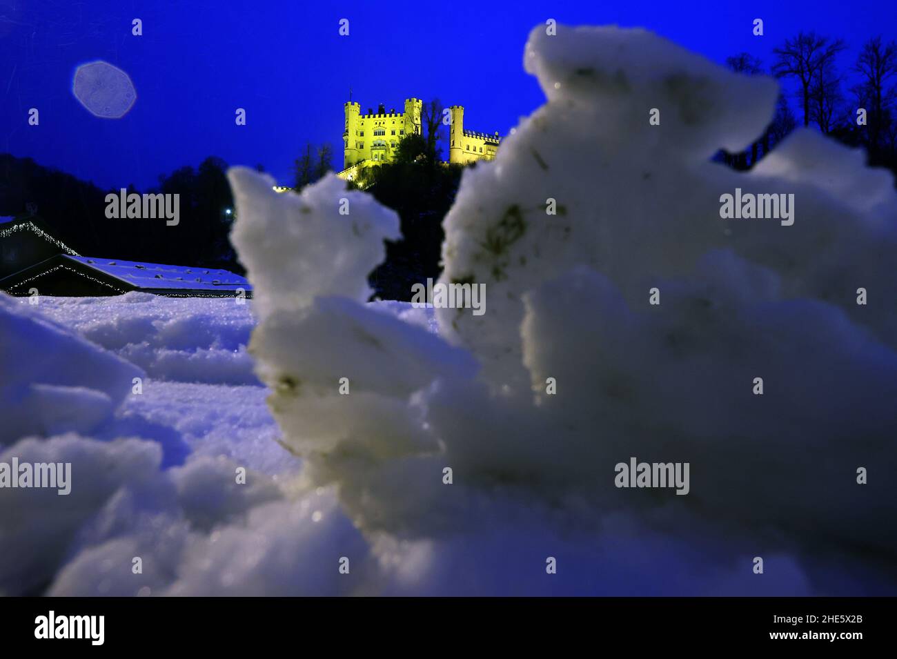Schwangau, Germany. 09th Jan, 2022. Hohenschwangau Castle stands behind ...