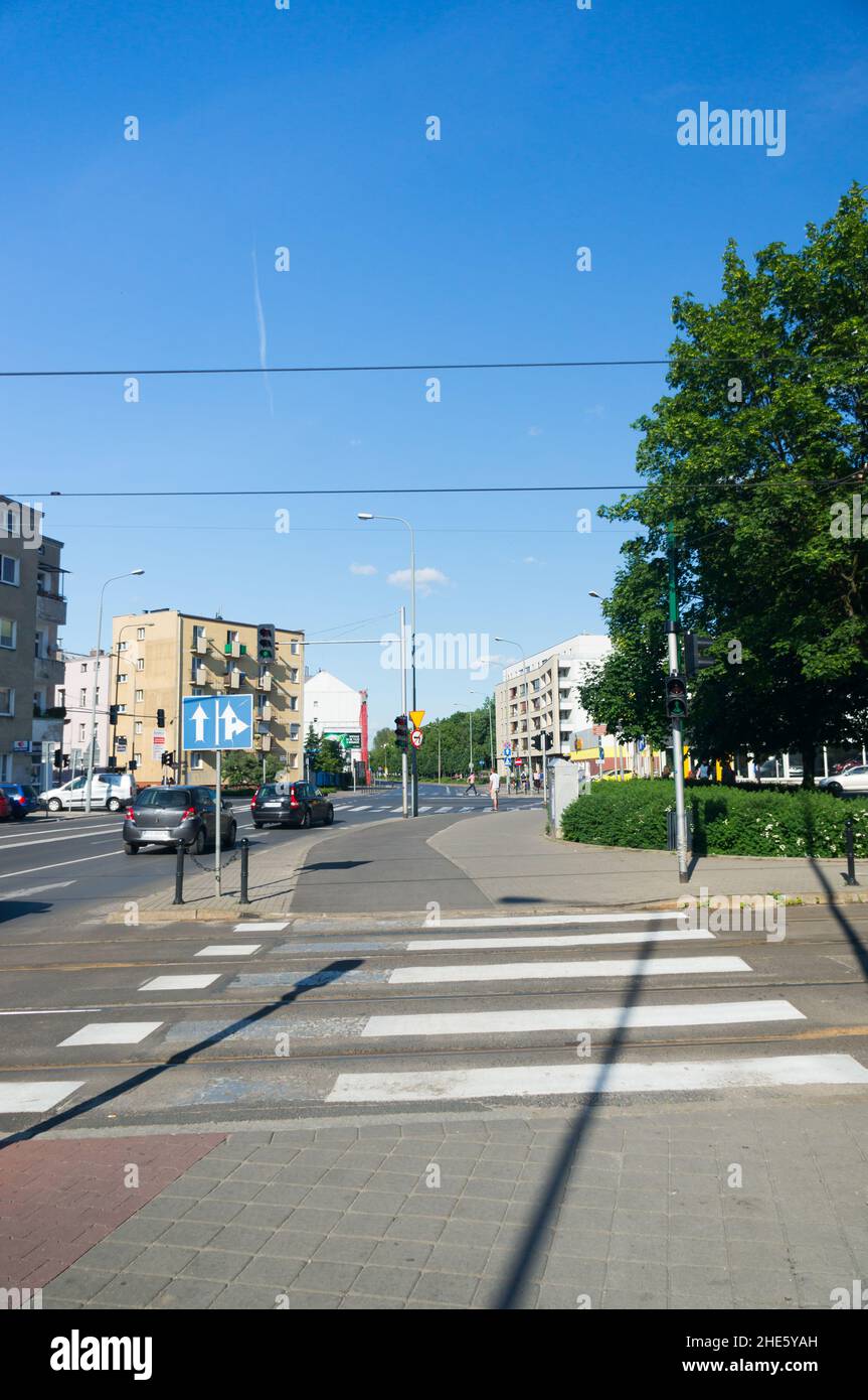 Zebra crossing leading to a sidewalk with apartment buildings Stock ...