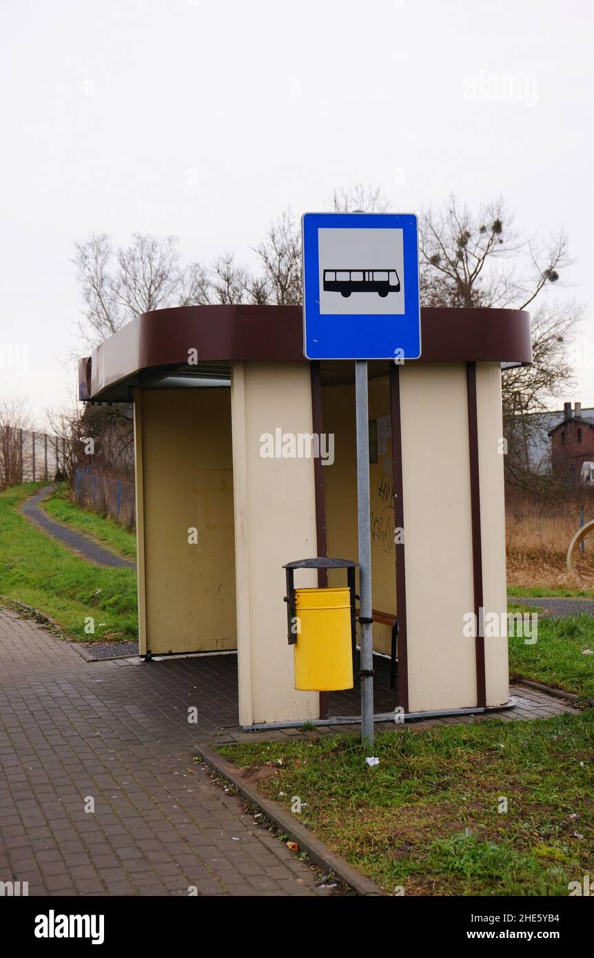 Bus public transport stop with trash bin and a board with a symbol ...