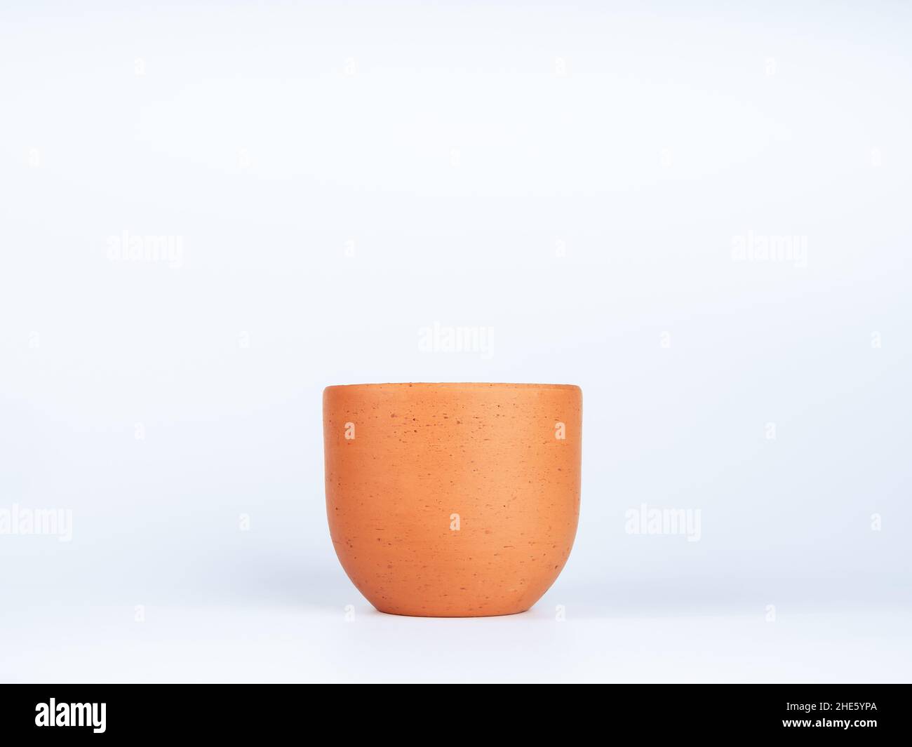 Empty round terra cotta pot isolated on white background with copy ...