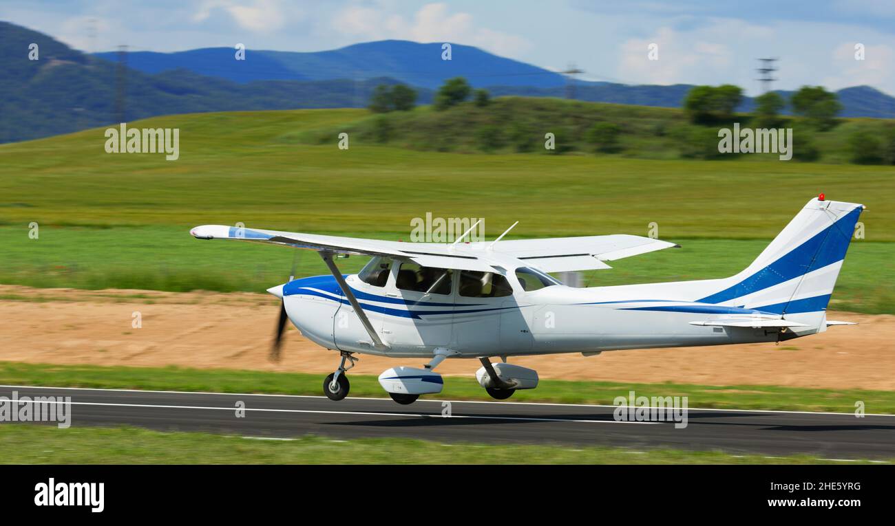 Sport airplane taking up from runway Stock Photo - Alamy