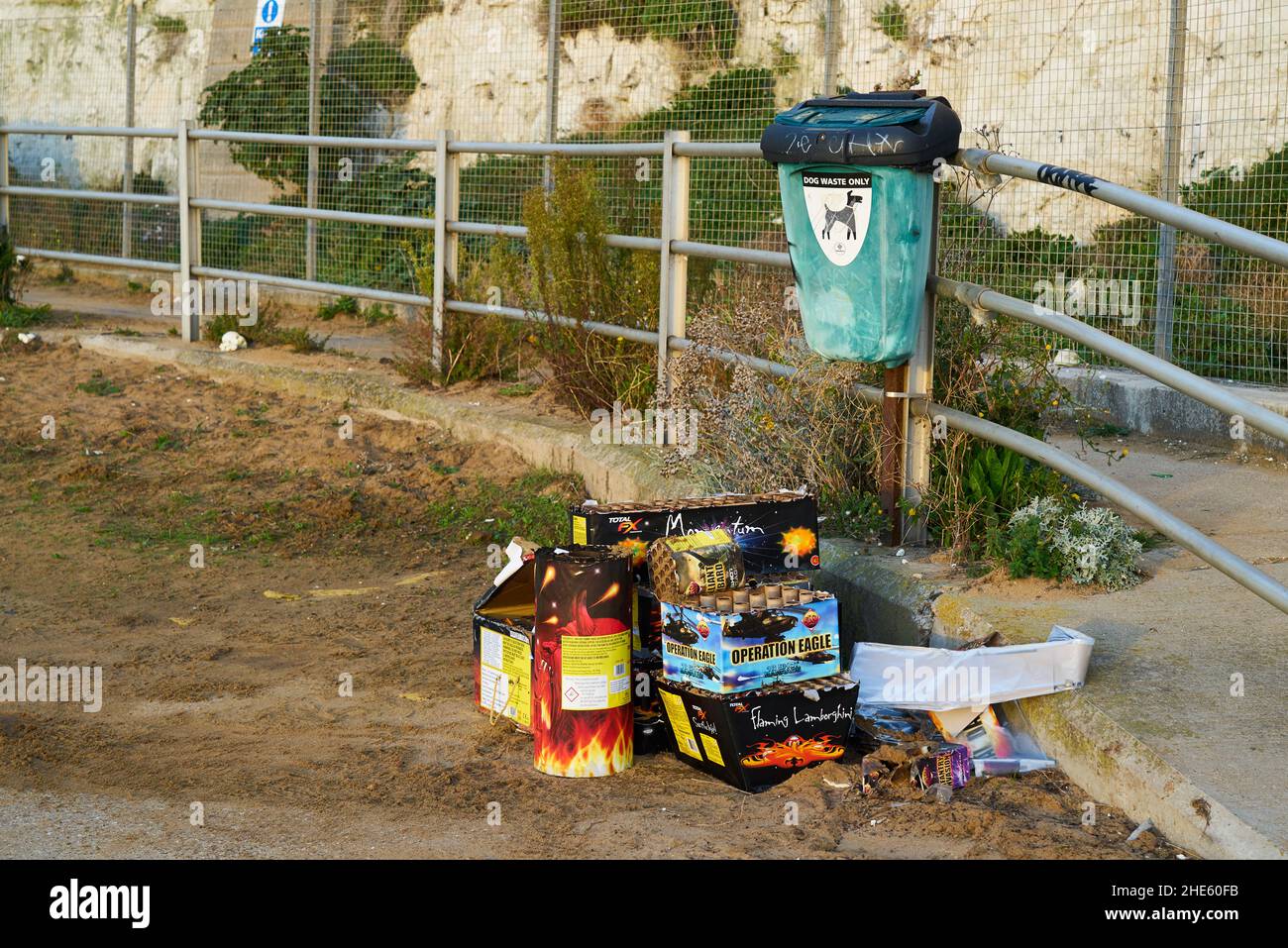 View of Spent fireworks left by a bin on the beach in the street in ...