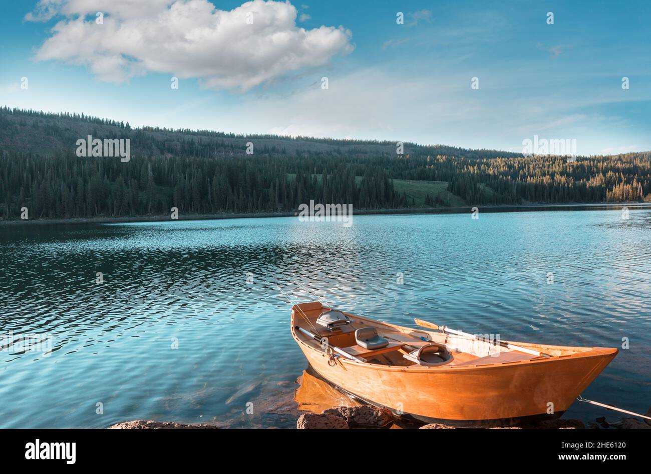Boat on a beautiful mountains lake Stock Photo - Alamy