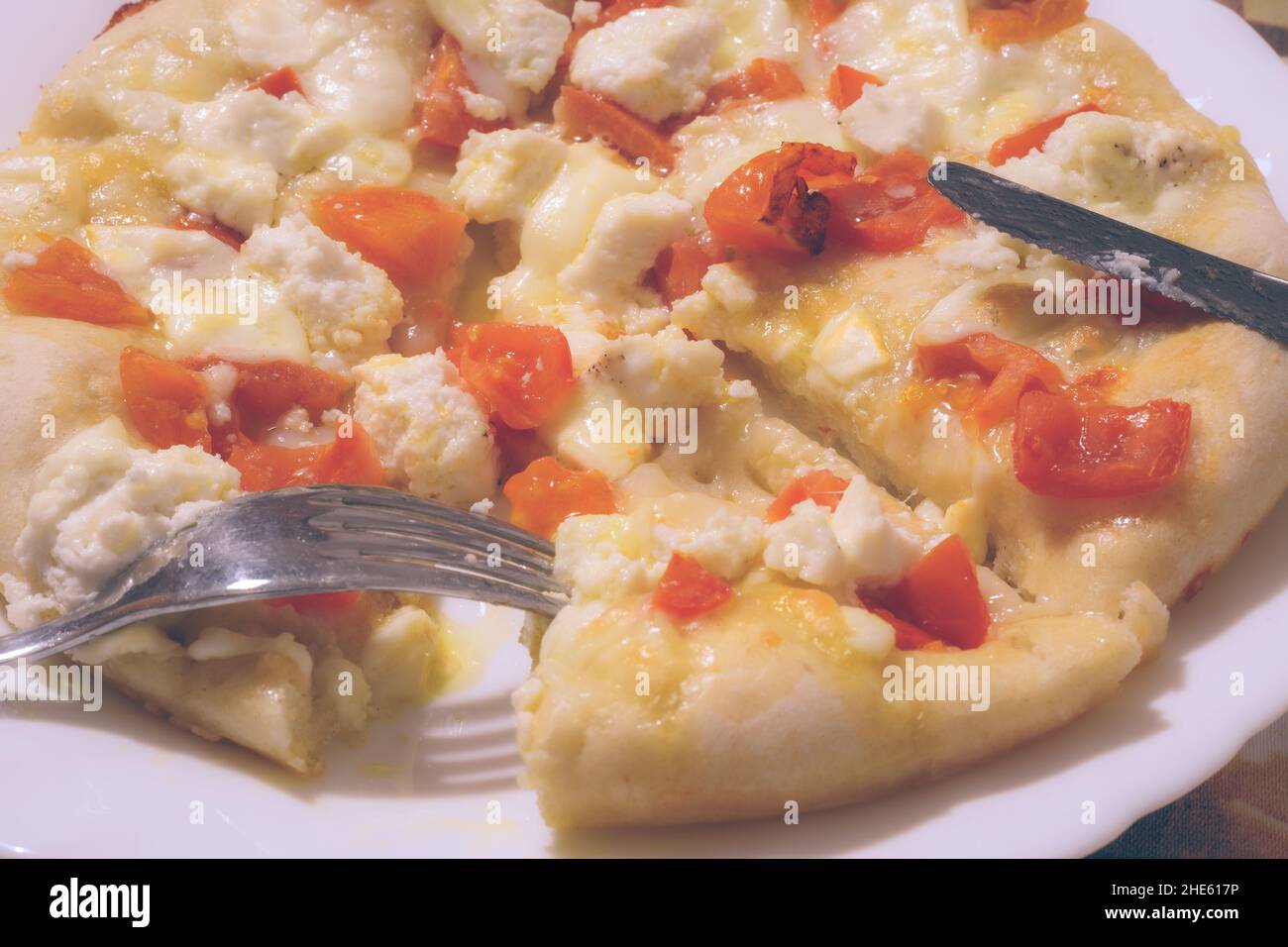 Homemade Pizza With Tomatoes And Mozzarella Cheese Stock Photo - Alamy